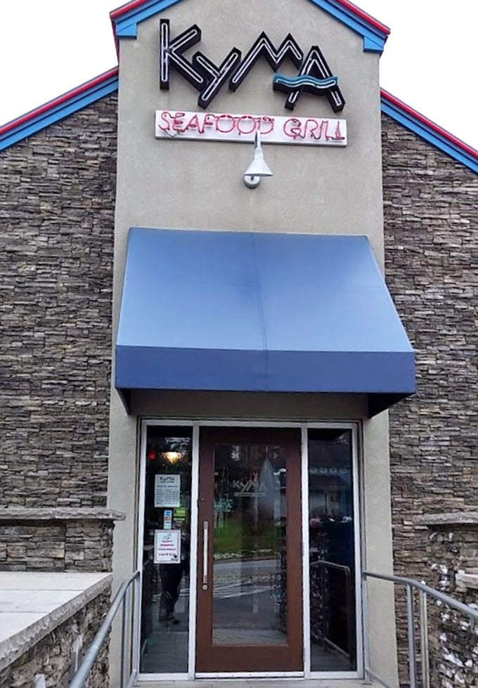 That blue awning beckons like a lighthouse guiding hungry souls to exceptional dining.