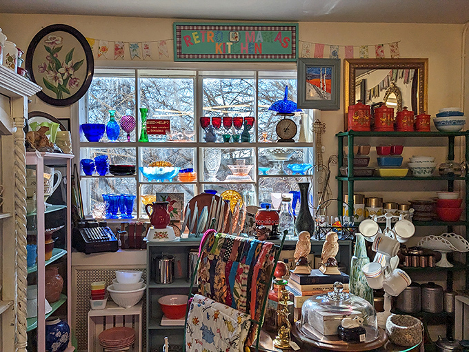 Colorful glassware catches sunlight like stained glass windows in a cathedral of vintage delights.