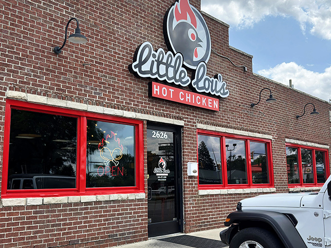 Those bright red window frames are your first warning: heat lives here, and it's deliciously dangerous in all the right ways.