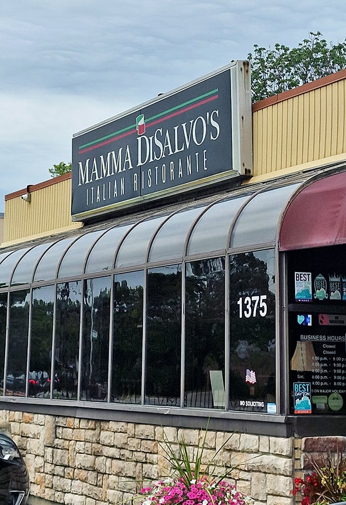 The stone accents and bright flowers say "welcome home" even before the aroma of garlic bread pulls you through the door.