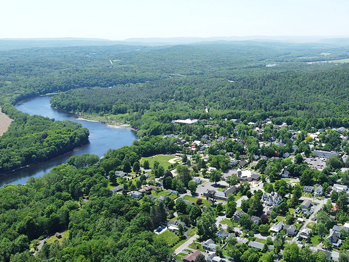 The Delaware flows past Milford like time itself, carrying dreams downstream toward bigger adventures.