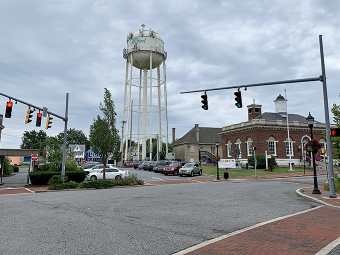 The town's water tower stands sentinel over streets that have mastered the art of small-town living.