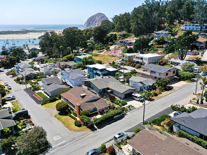 Morro Bay's iconic rock stands sentinel over a town where fishing boats and pleasure craft share the peaceful harbor.