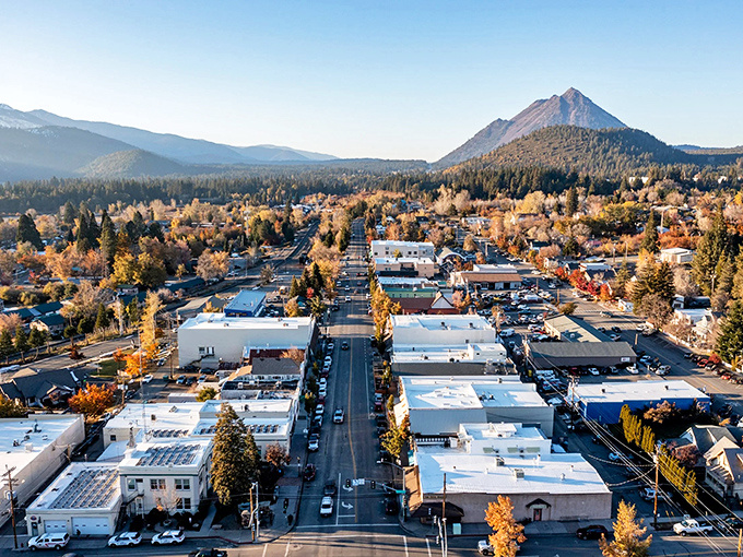 This aerial view shows how perfectly Mount Shasta nestles between forest and that towering namesake mountain.