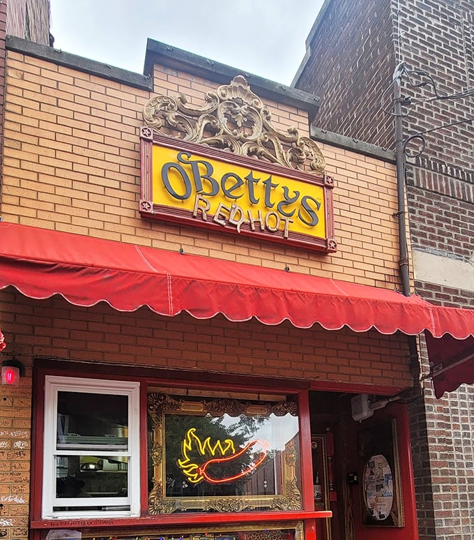 The decorative flourishes and classic red awning whisper promises of hot dogs made with genuine care and pride.