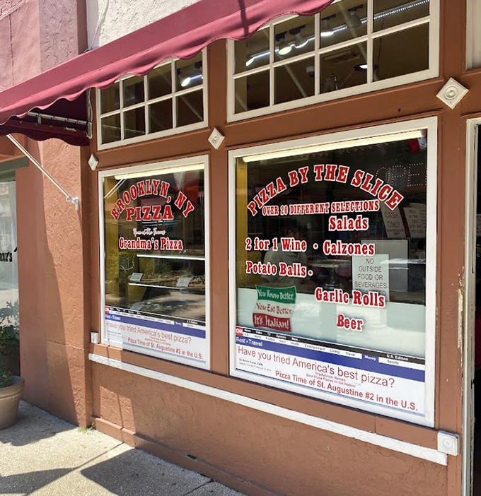 Those red and white stripes and patriotic flags create the perfect backdrop for authentic Italian-American pizza perfection.