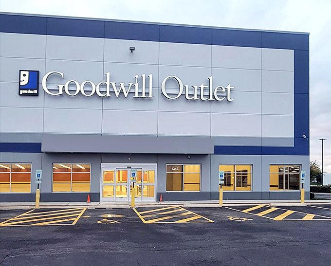 Goodwill Outlet's illuminated entrance beckons serious thrifters like moths to a bargain-priced flame.