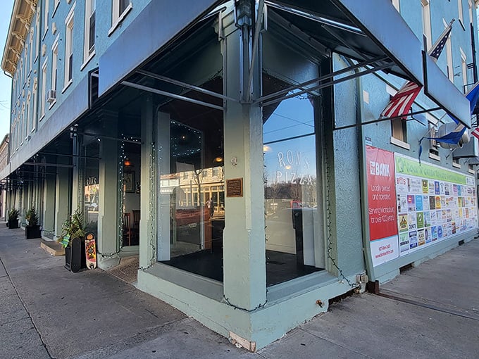 The soft blue exterior of Ron's Pizza stands out in downtown Miamisburg. Behind those windows, pizza magic happens daily.