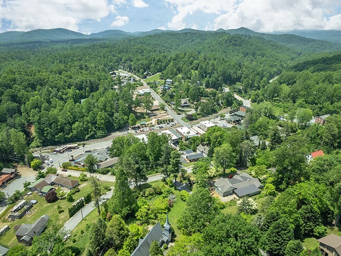Saluda Aerial View: Mountains hugging a tiny town! Saluda sits like a hidden treasure in nature's pocket, waiting to be discovered.