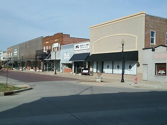 Downtown storefronts stand shoulder to shoulder like old friends sharing secrets across the generations.