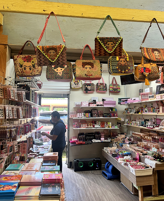 Colorful handbags featuring iconic Mexican artist imagery hang like festive decorations. Cultural treasures and everyday necessities live side by side here.