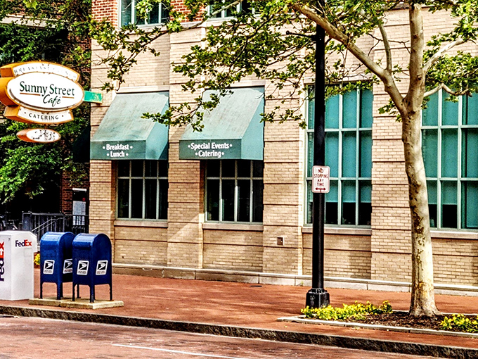 Green awnings and golden brick create the perfect backdrop for downtown dining that feels like neighborhood comfort.