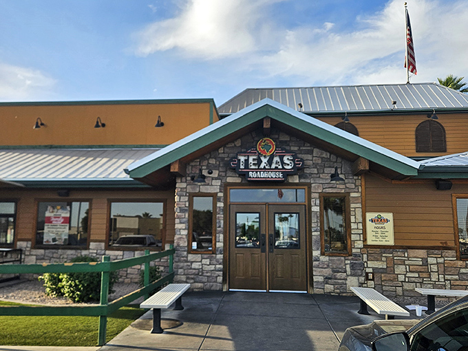 The American flag flies proudly over this Texas Roadhouse, where patriotism and perfectly-cooked ribeyes go hand in hand.