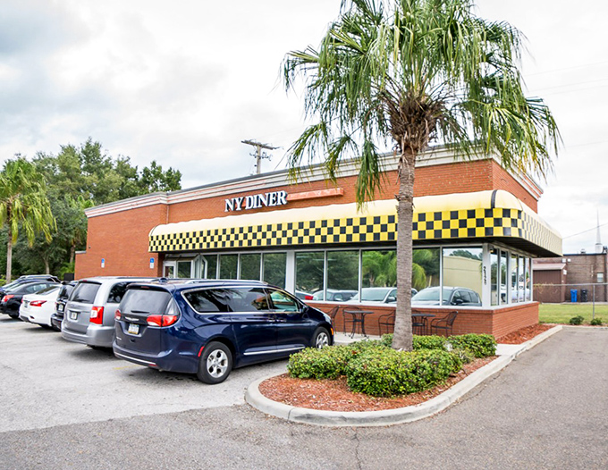 Classic brick and checkered patterns create the perfect backdrop for serious comfort food conversations.