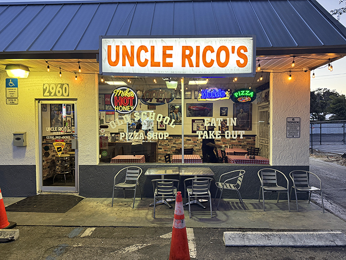 At night, the warm glow from this humble shop beckons pizza lovers like moths to a perfectly baked flame.