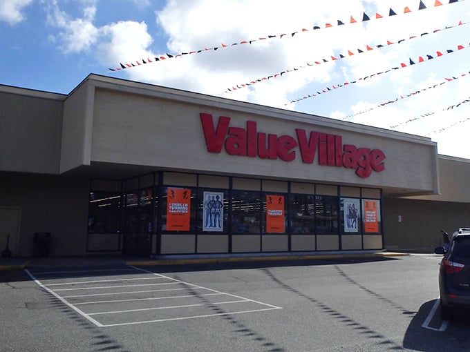 Thrift shopping on a grand scale! Value Village's expansive storefront with festive flags signals this isn't your average secondhand shop.