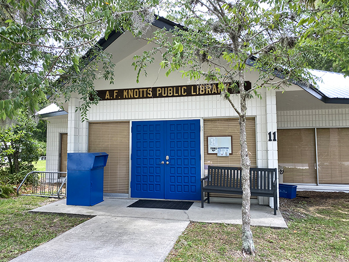 The A.F. Knotts Public Library proves that even in the digital age, small towns understand that books and blue doors make for perfect neighbors.