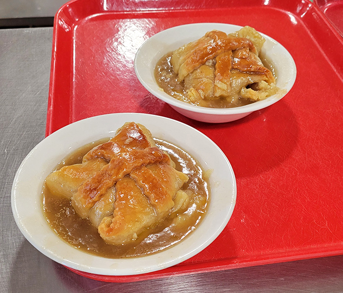 These apple dumplings aren't just dessert&mdash;they're edible nostalgia, wrapped in flaky pastry and swimming in a cinnamon-spiced sauce that demands to be savored.