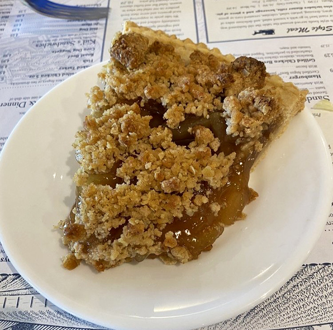 Apple pie with that perfect crumble topping&mdash;the kind that makes you consider ordering a second slice "for the road" before you've finished the first.