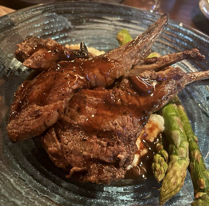 Lamb chops that look like they've been kissed by fire and blessed by culinary angels. Asparagus never had such distinguished company.