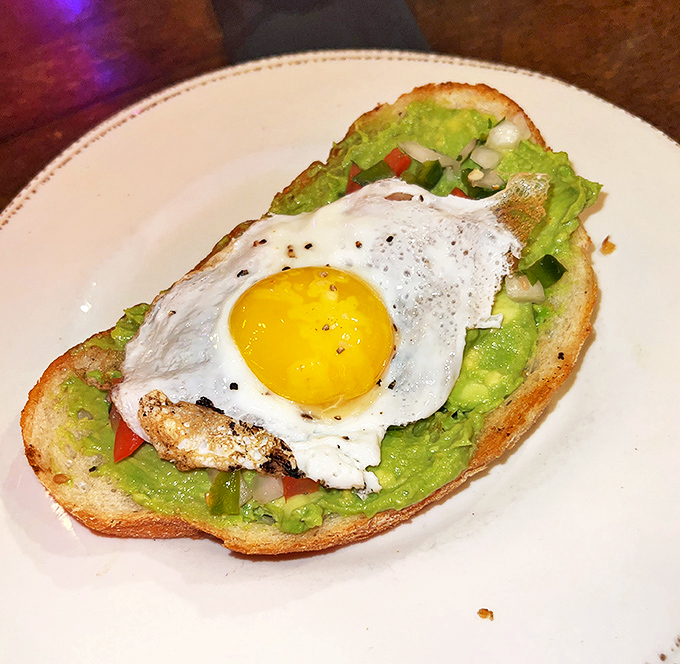 Avocado toast gets the Nashville treatment with a perfectly sunny-side-up egg perched atop vibrant green goodness&mdash;healthy-ish never looked so tempting.