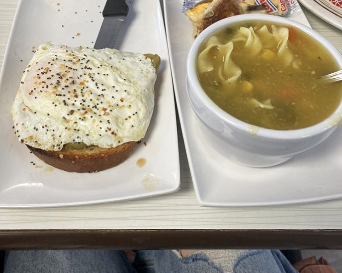 Simple pleasures done right &ndash; a perfectly fried egg atop hearty toast alongside homemade soup that warms you from the inside out.