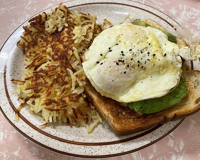 Avocado toast that doesn't require a second mortgage, topped with an egg that's sunny-side up &ndash; just like your mood will be after eating it.