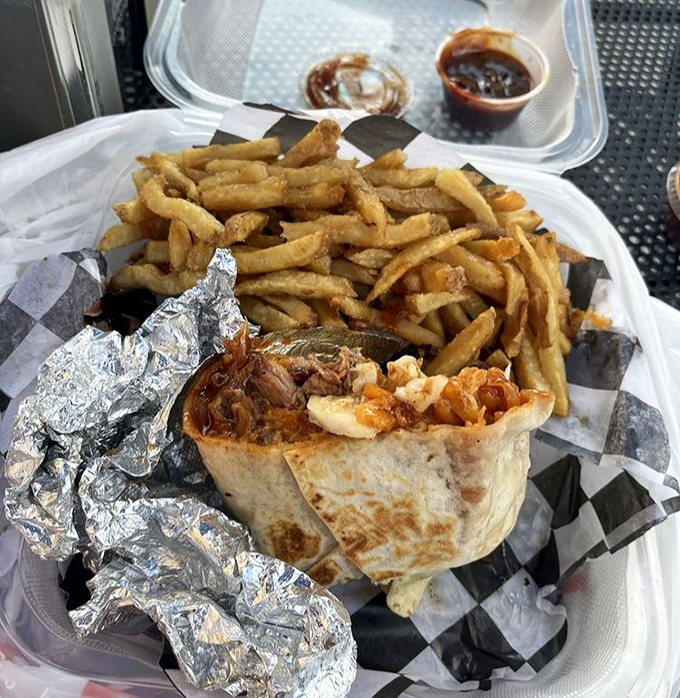 The BBQ burrito wrapped in foil like the precious gift it is, with fries standing by for the inevitable sauce-sopping duties.