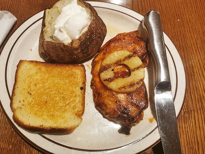 BBQ chicken with a charred pineapple ring and a loaded baked potato&mdash;proof that sometimes the simple classics deliver the most satisfaction.