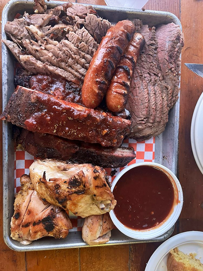 This BBQ combo platter is the United Nations of meat&mdash;bringing together ribs, brisket, chicken, and sausage in delicious diplomatic relations.