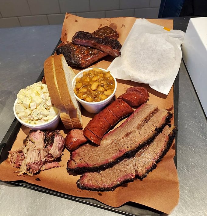 When your tray arrives loaded with multiple meats, sides, and bread, it's like Christmas morning &ndash; if Santa smoked brisket instead of delivering toys.