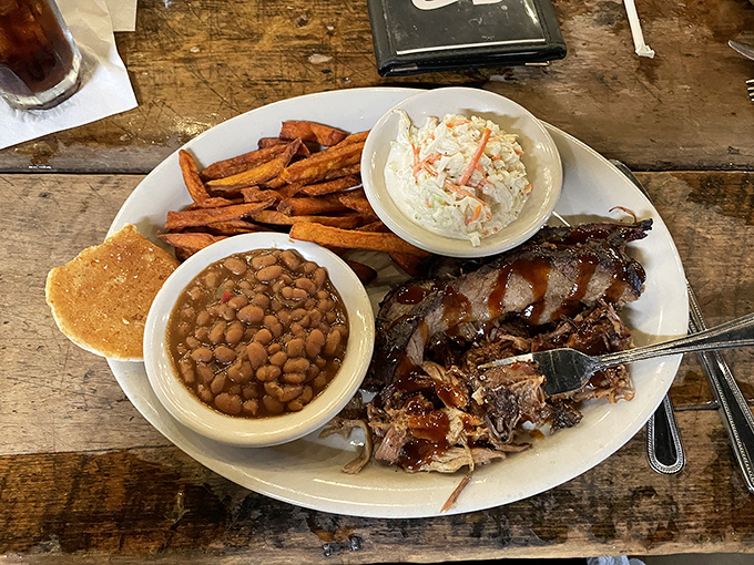 BBQ that respects tradition while creating its own &ndash; tender pulled pork alongside baked beans and slaw on a plate that's basically Tennessee's greatest hits album.