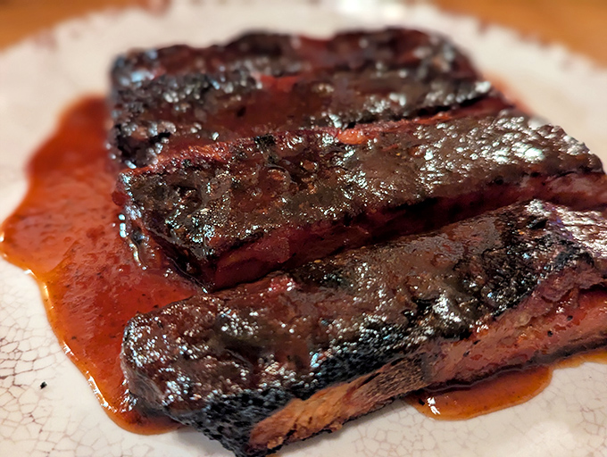 Glistening ribs bathed in sauce that's traveled the perfect distance between sweet and tangy &ndash; resistance is futile.