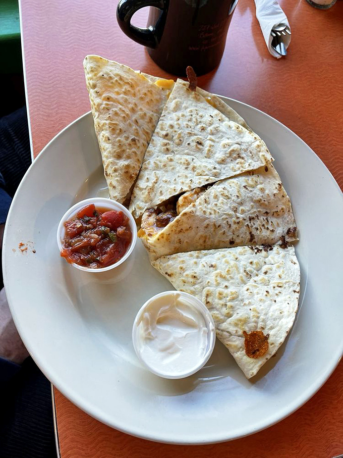 Quesadillas: the universal language of "I'm about to make your day better." Crispy, cheesy triangles of joy with salsa that means business.