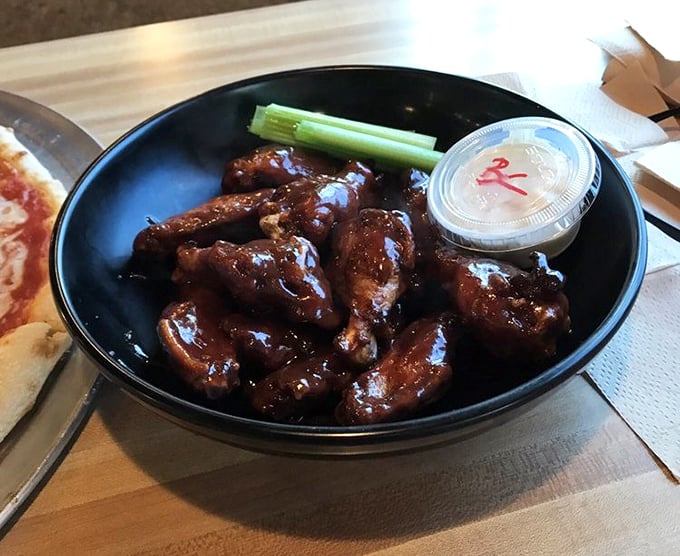 These aren't just wings; they're sticky-sweet flavor bombs. The celery stick is merely a suggestion of vegetable virtue.
