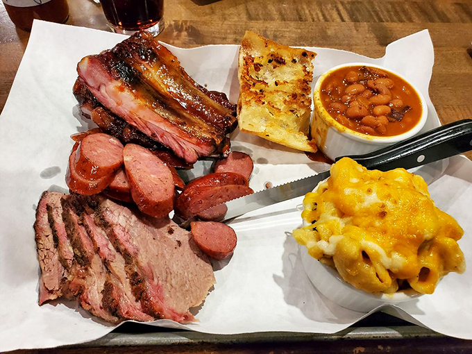 The barbecue sampler that answers the eternal question, "Why choose one meat when you can have them all?" Pure protein poetry on a plate.