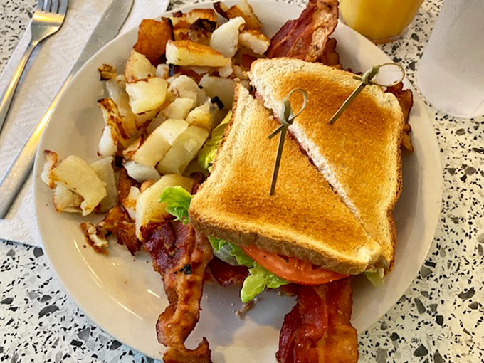 The BLT&mdash;where bacon is the star, not just a supporting actor. Paired with those home fries, it's a lunch that demands a post-meal nap.