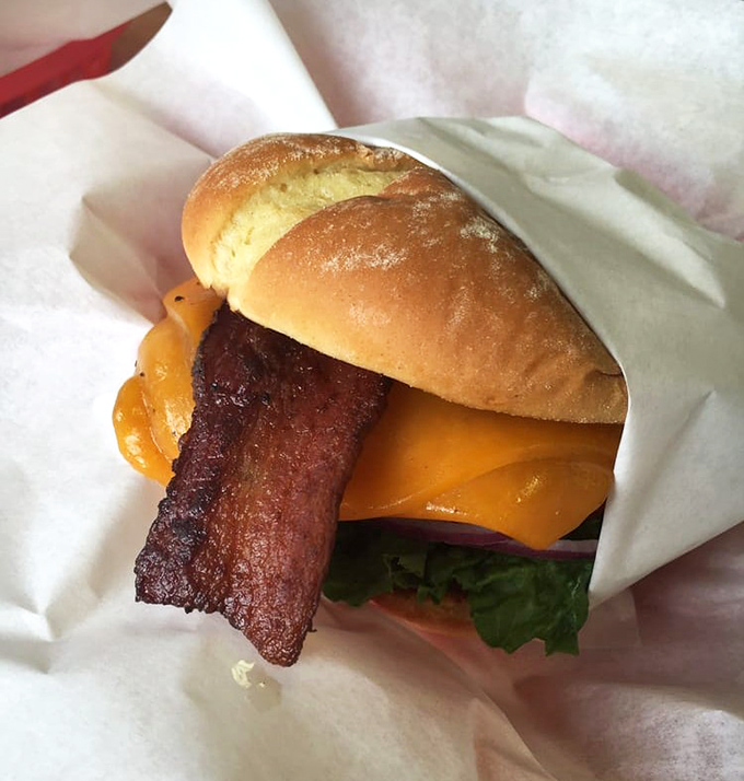 When bacon and cheese join forces with a perfect patty, wrapped in paper like the gift to humanity it truly is.