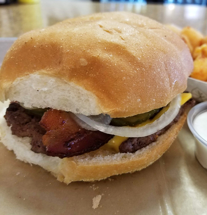 Some relationships are complicated. The bond between bacon, beef, and cheese is not one of them. This is commitment on a bun.