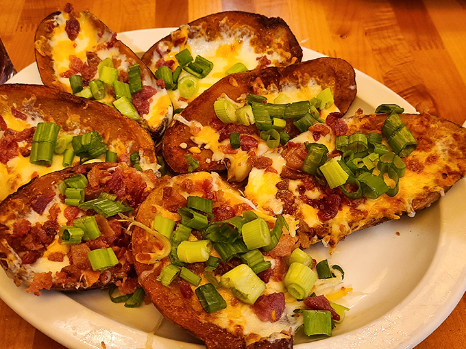 Bacon potato skins loaded with enough toppings to make your cardiologist weep tears of both joy and concern.
