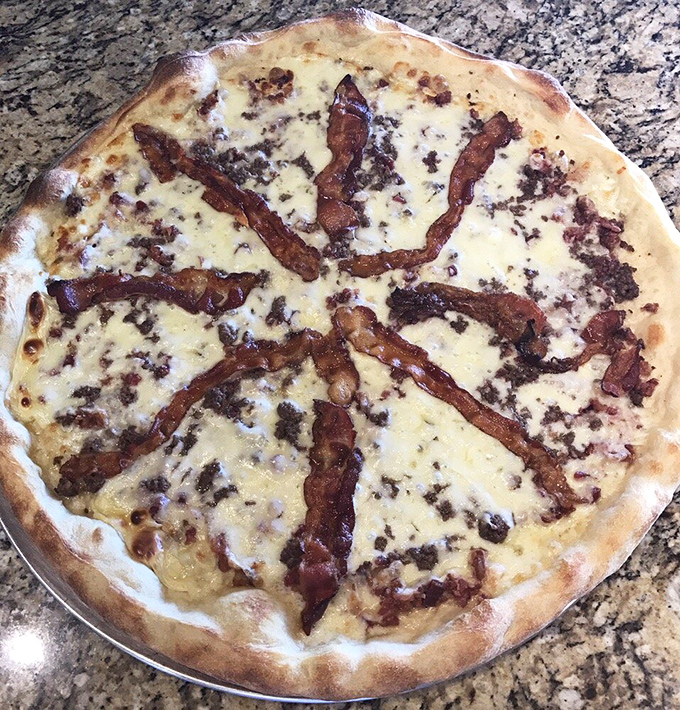 The bacon cheeseburger pizza – when you can't decide between two American classics, why not have both? Comfort food squared.