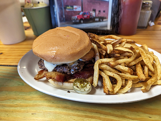 Sweet potato fries and a bacon cheeseburger&mdash;the culinary equivalent of finding money in an old jacket pocket. Unexpected joy on a black plate.