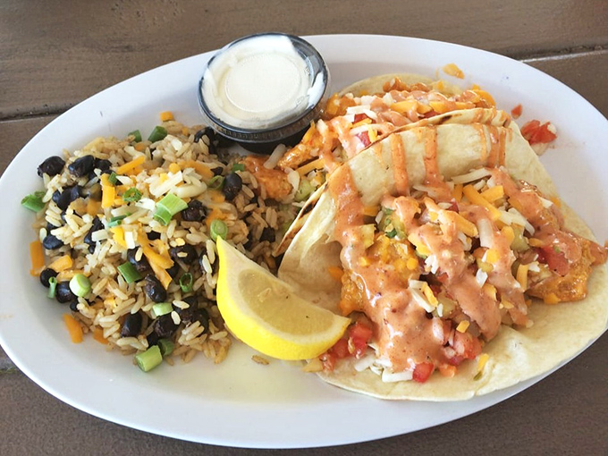 Vacation on a plate: Baja shrimp tacos with a colorful rice sidekick&mdash;proof that the best souvenirs from Florida are the flavor memories.