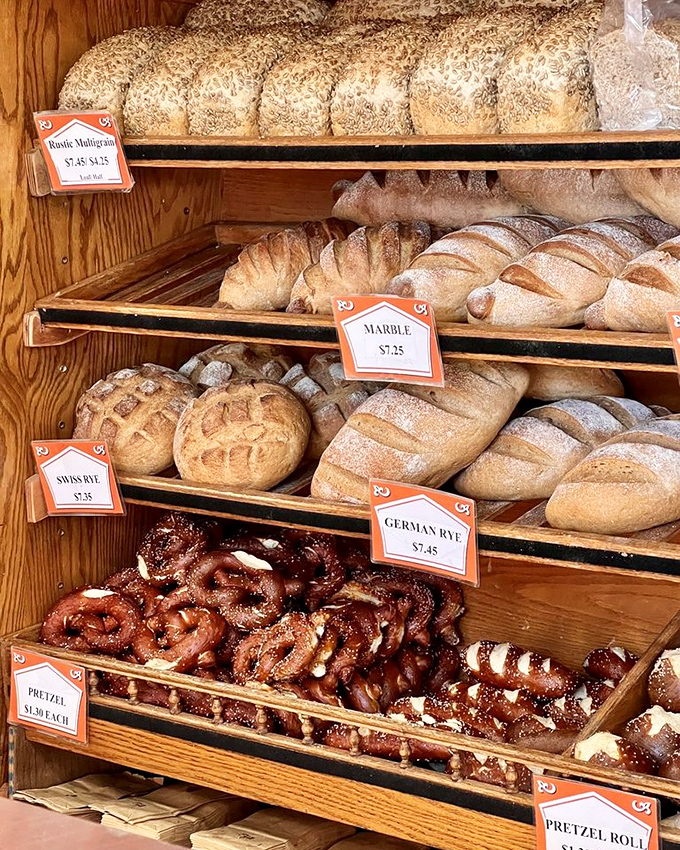 Carb heaven exists, and it's stocked daily. From rustic loaves to pretzel rolls, this bread display is where gluten-free resolutions go to die.