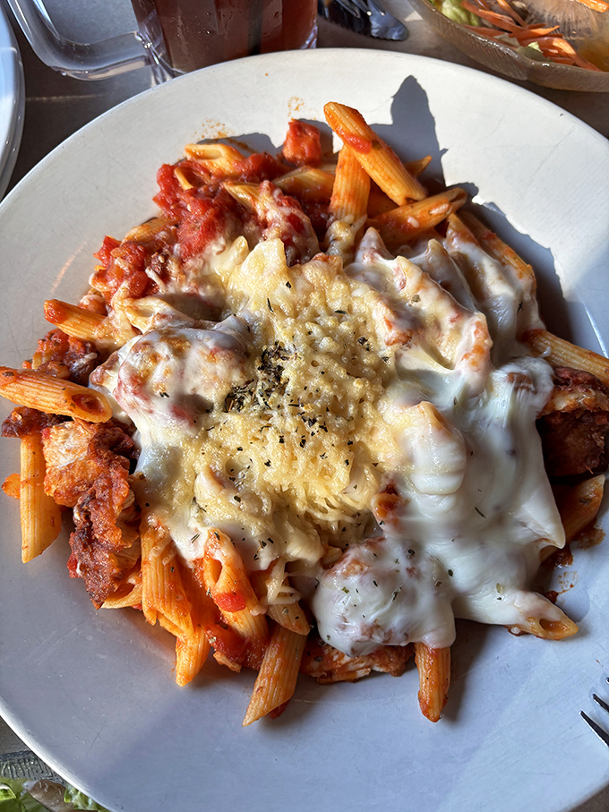 Pasta that doesn't just sit on the plate but performs—cheese stretching skyward like it's auditioning for a food commercial.