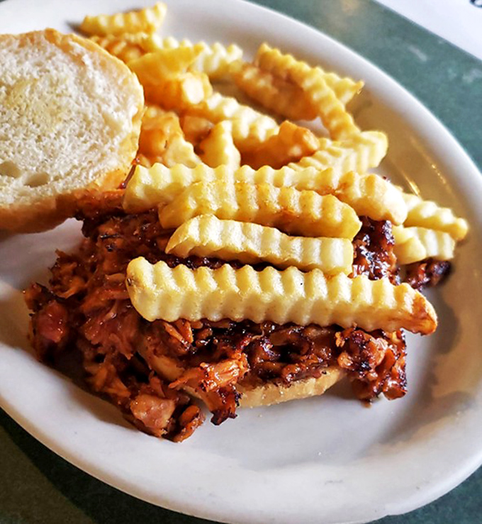BBQ chicken sandwich with crinkle-cut fries&mdash;proof that sometimes the simplest combinations make for the most satisfying meals.