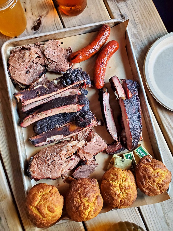 Barbecue perfection on butcher paper&mdash;where smoke ring meets cornbread and hot links. This tray is worth every minute of the inevitable food coma.