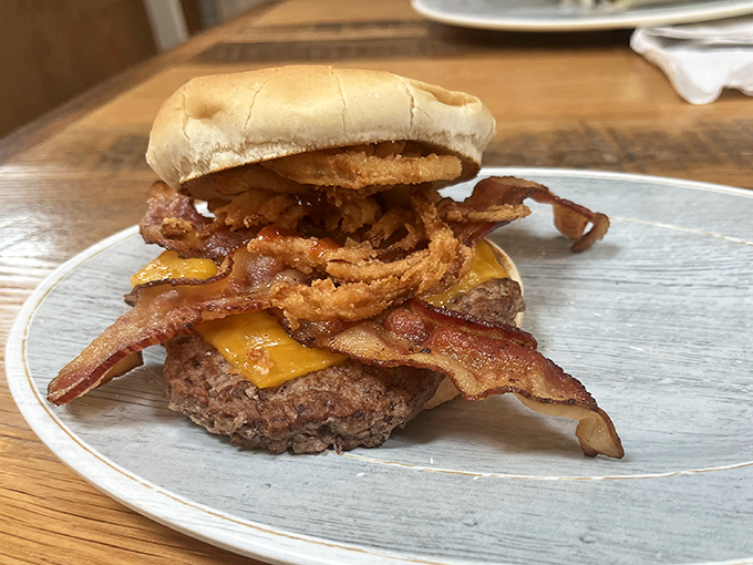 This isn't just a burger&mdash;it's an engineering marvel of beef, bacon, cheese, and onion rings that requires both hands and possibly a nap afterward.
