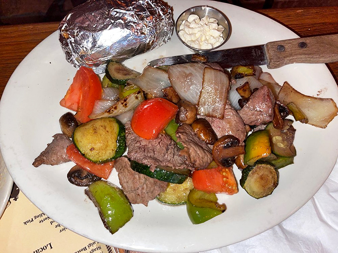 Who needs fancy plating when flavor takes center stage? Tender steak and fresh vegetables come together in a rustic presentation that satisfies both eyes and appetite.