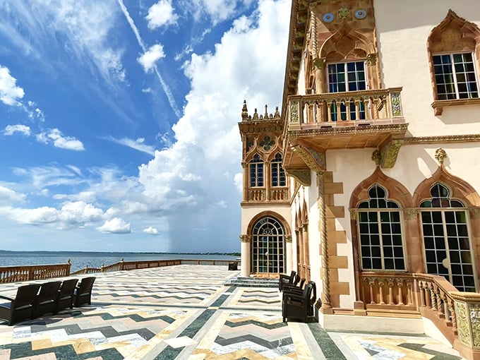 The bayfront terrace offers geometric perfection against Sarasota's endless horizon&mdash;where mathematical precision meets Florida's wild natural beauty.